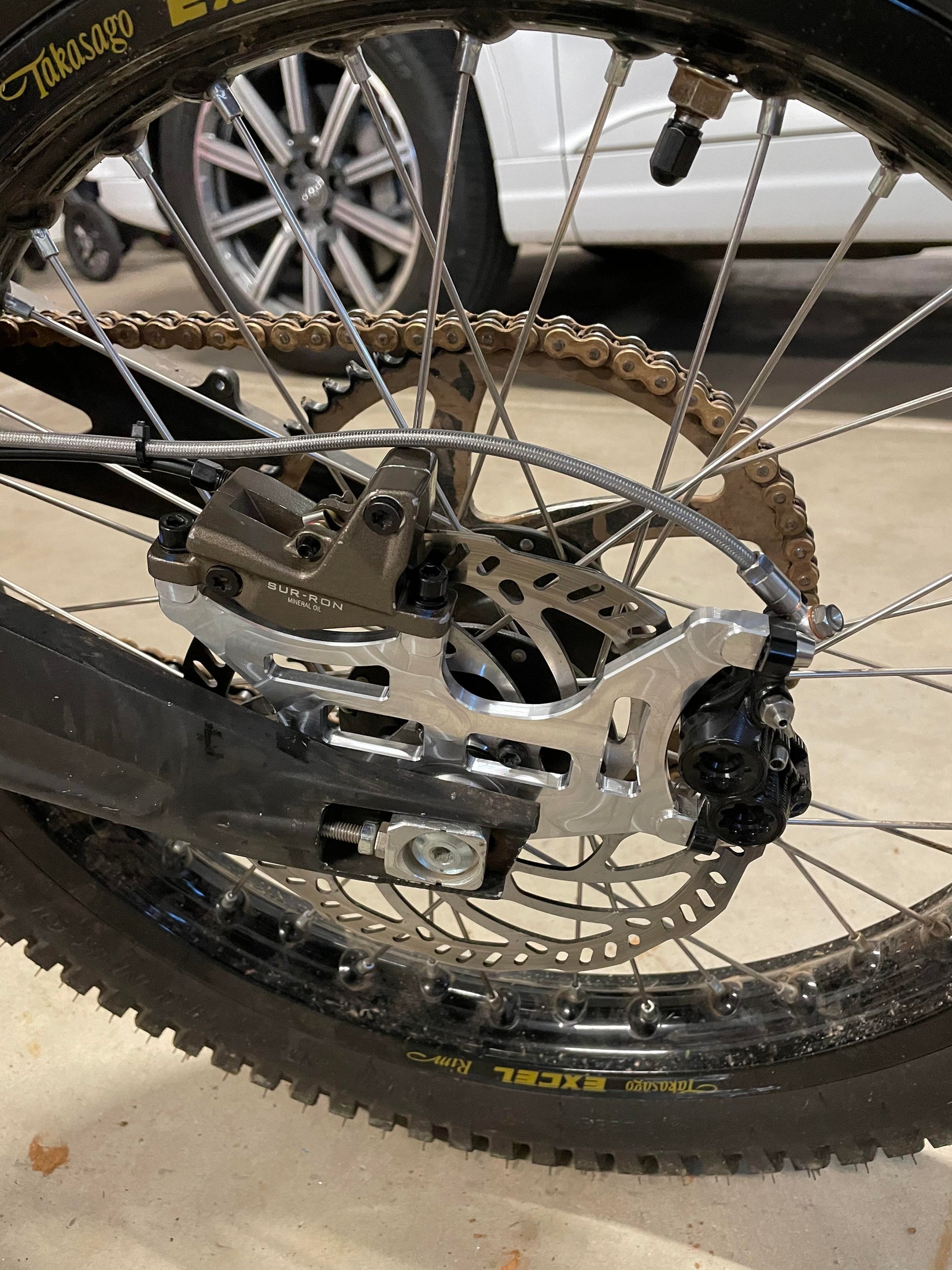 Sur-Ron Dual Rear Caliper Bracket – REVRides